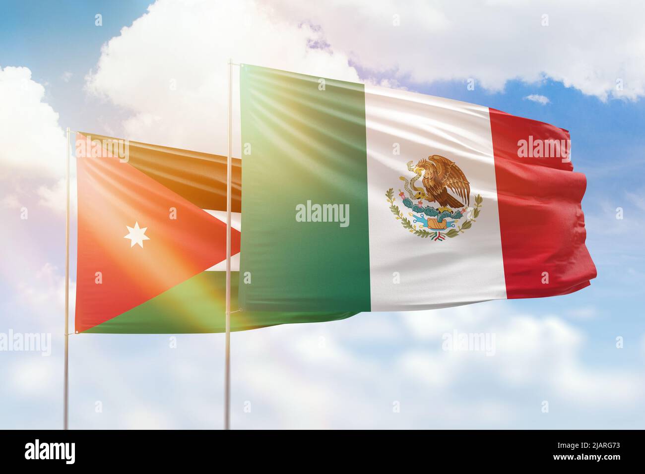 Sunny blue sky and flags of mexico and jordan Stock Photo - Alamy