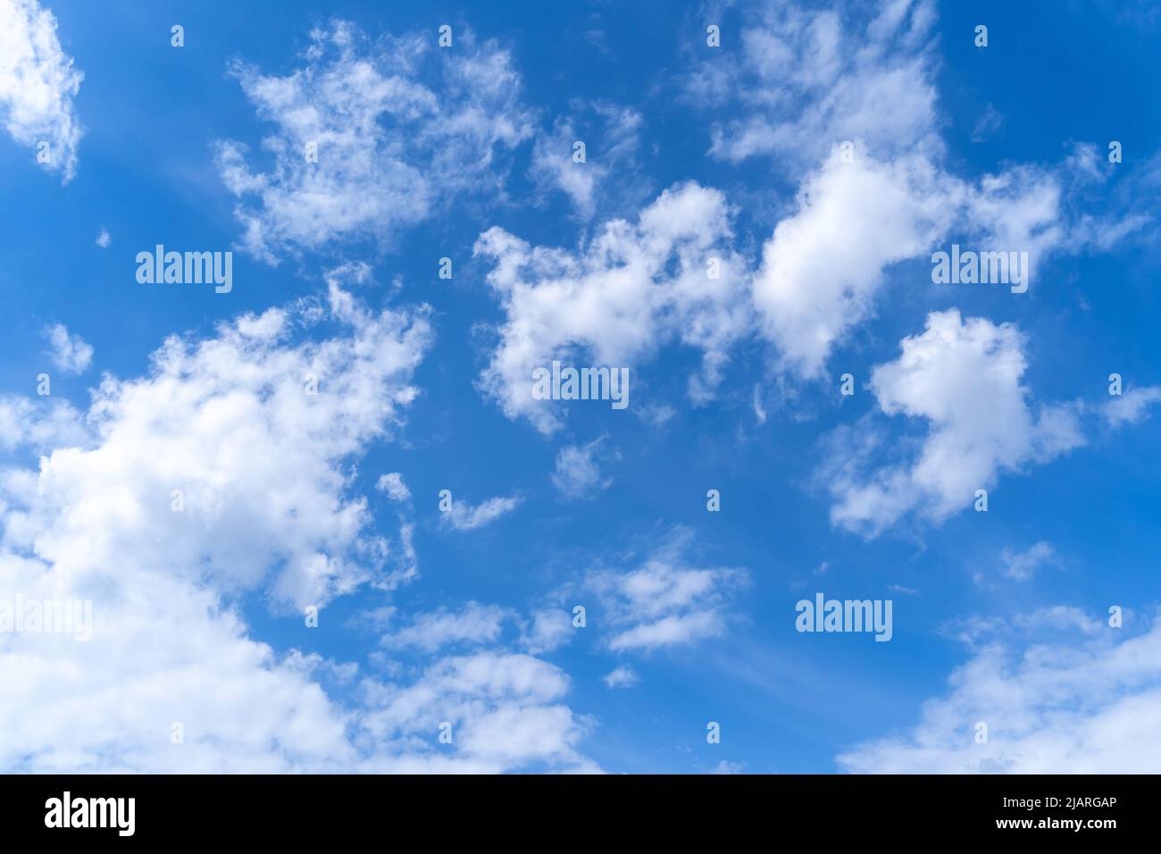 Blue sky background with white fluffy clouds. Clear weather, a feeling ...