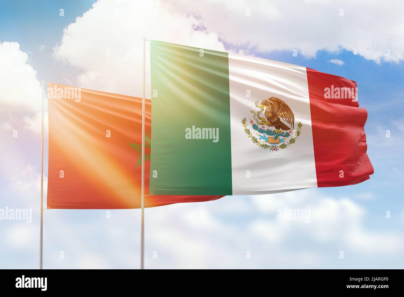 Sunny blue sky and flags of mexico and morocco Stock Photo - Alamy