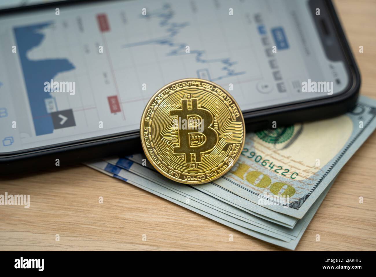 Bitcoin BTC Cryptocurrency coins and US dollar banknotes next to a ...