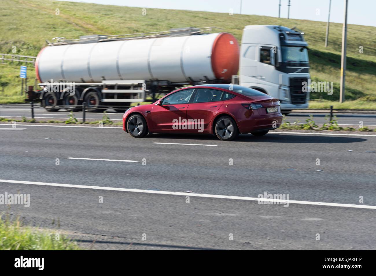 Electric Car (Tesla) on the M62 (near Huddersfield, England Stock Photo ...
