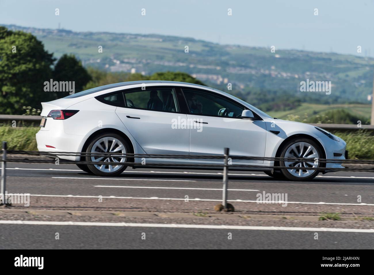 Electric Car (Tesla) on the M62 (near Huddersfield, England Stock Photo ...