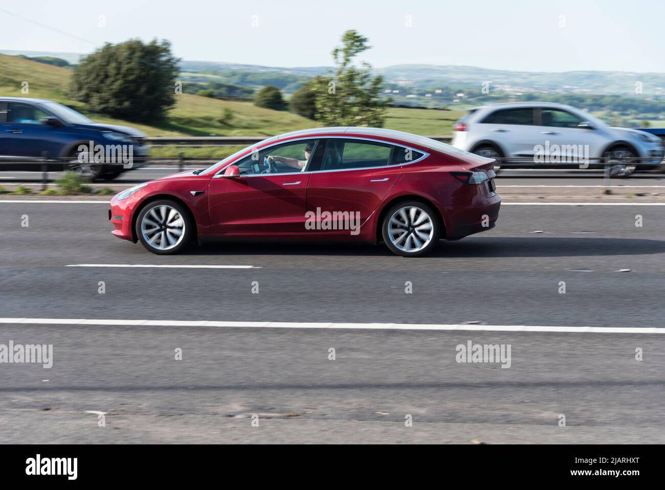 Electric Car (Tesla) on the M62 (near Huddersfield, England Stock Photo ...