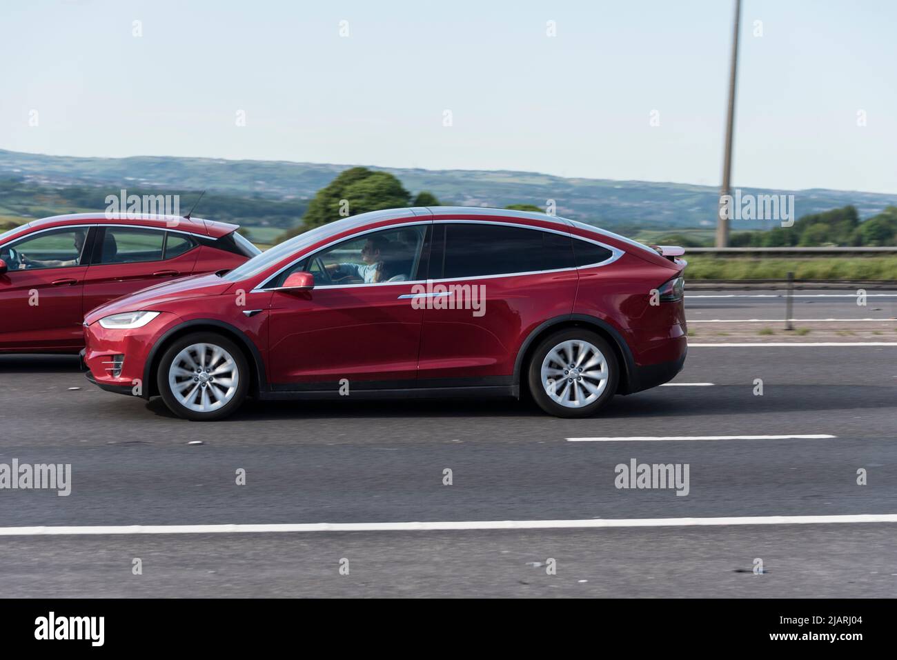 Electric Car (Tesla) on the M62 (near Huddersfield, England Stock Photo ...