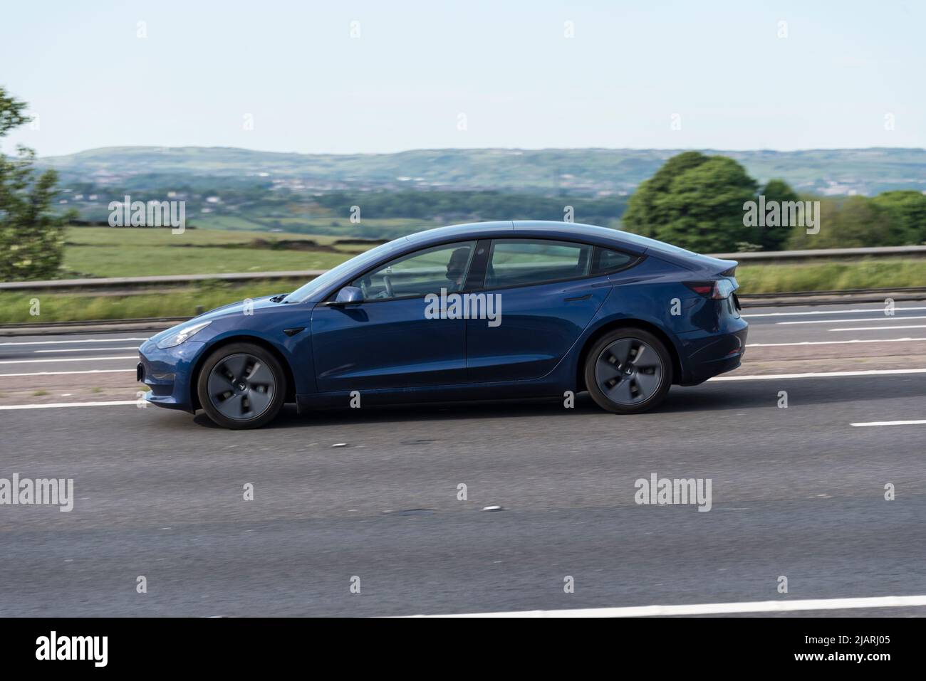 Electric Car (Tesla) on the M62 (near Huddersfield, England Stock Photo ...