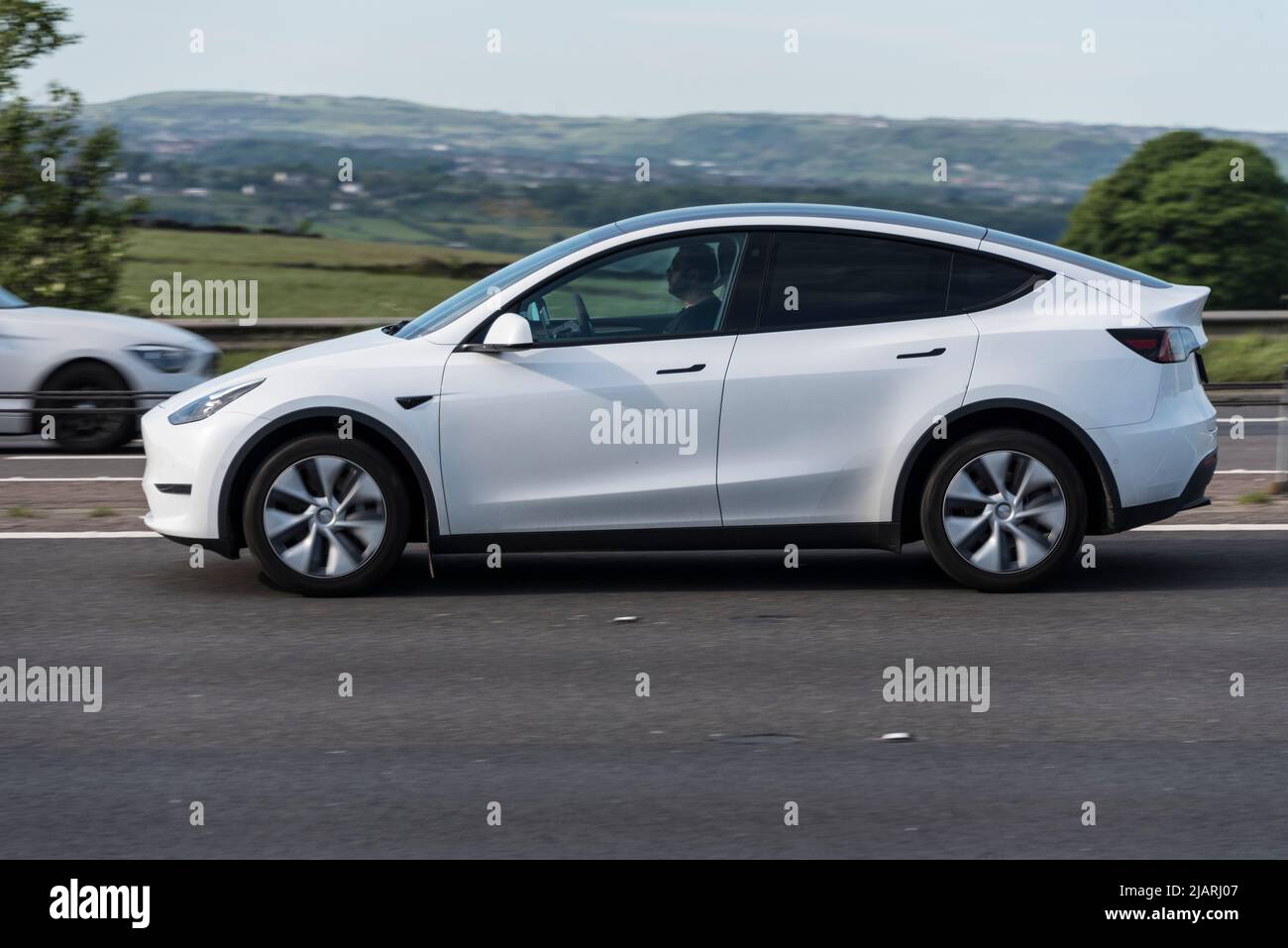 Electric Car (Tesla) on the M62 (near Huddersfield, England Stock Photo ...