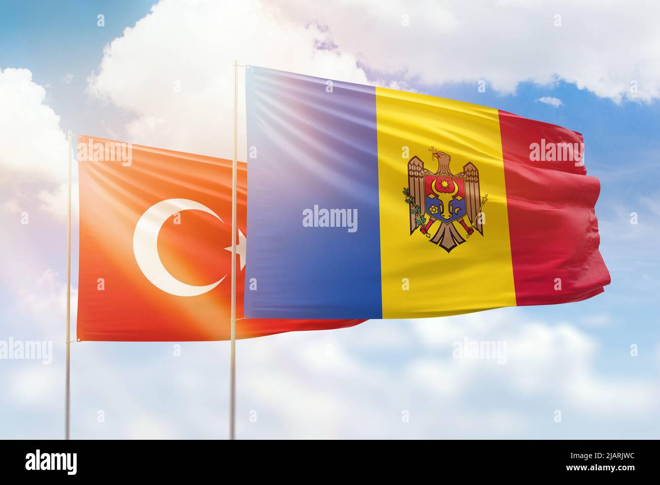 Sunny blue sky and flags of moldova and turkey Stock Photo - Alamy