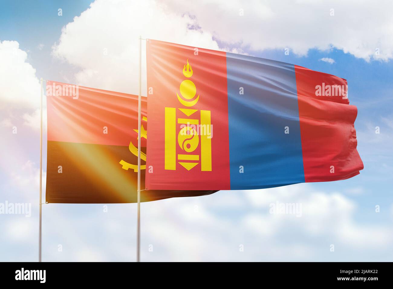 Sunny blue sky and flags of mongolia and angola Stock Photo - Alamy