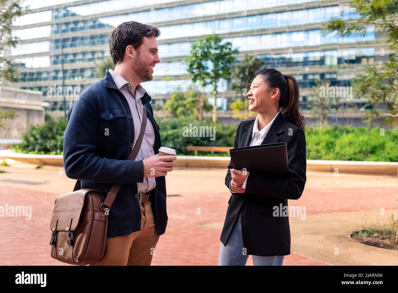 Happy cheerful coworkers chatting hi-res stock photography and images ...