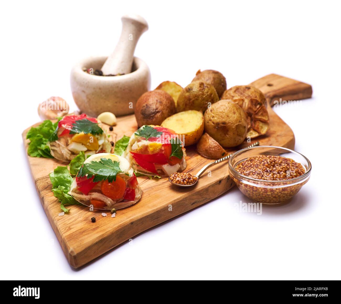 Portion of delicious chicken aspic on serving board isolated on white ...