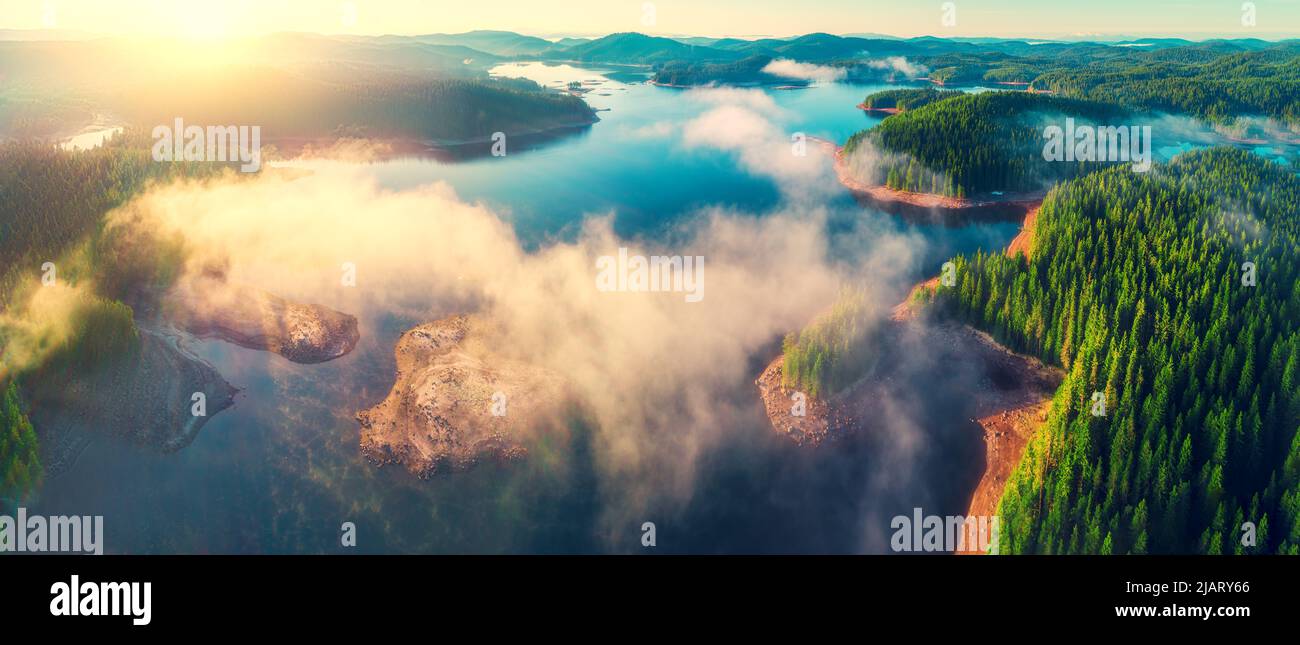 Aerial view of morning fog on the lake, sunrise shot Stock Photo - Alamy