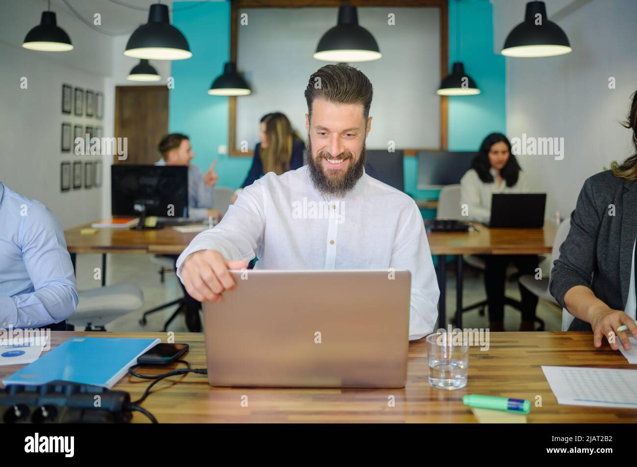 Man laptop cheerful table smile hi-res stock photography and images - Alamy