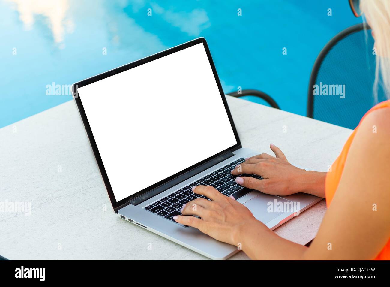 laptop with blank screen near the pool Stock Photo - Alamy