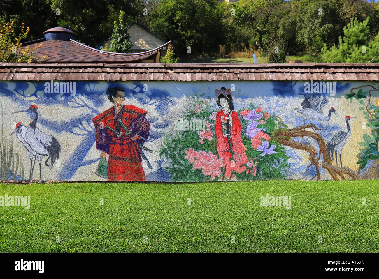 Beautiful mural on wall in Japanese park. Woman and man in national ...