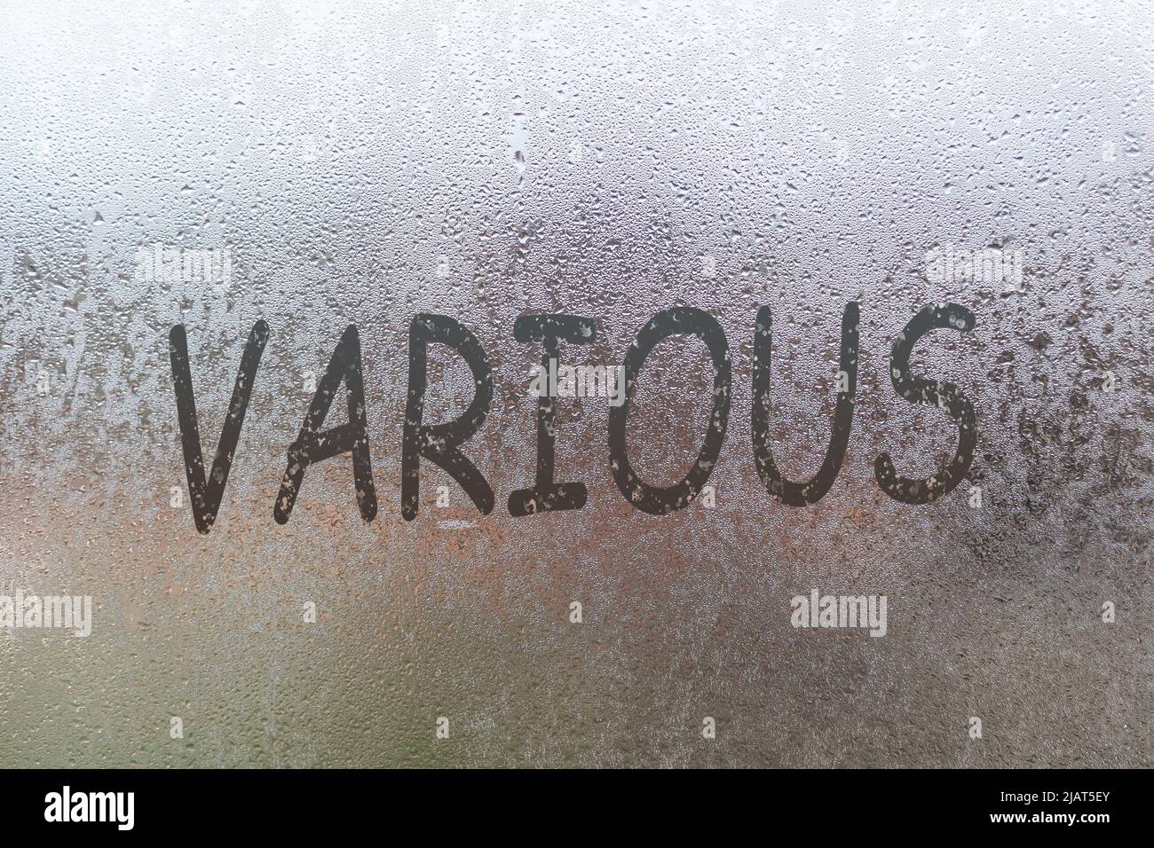 Foggy glass on window with written finger word various Stock Photo - Alamy