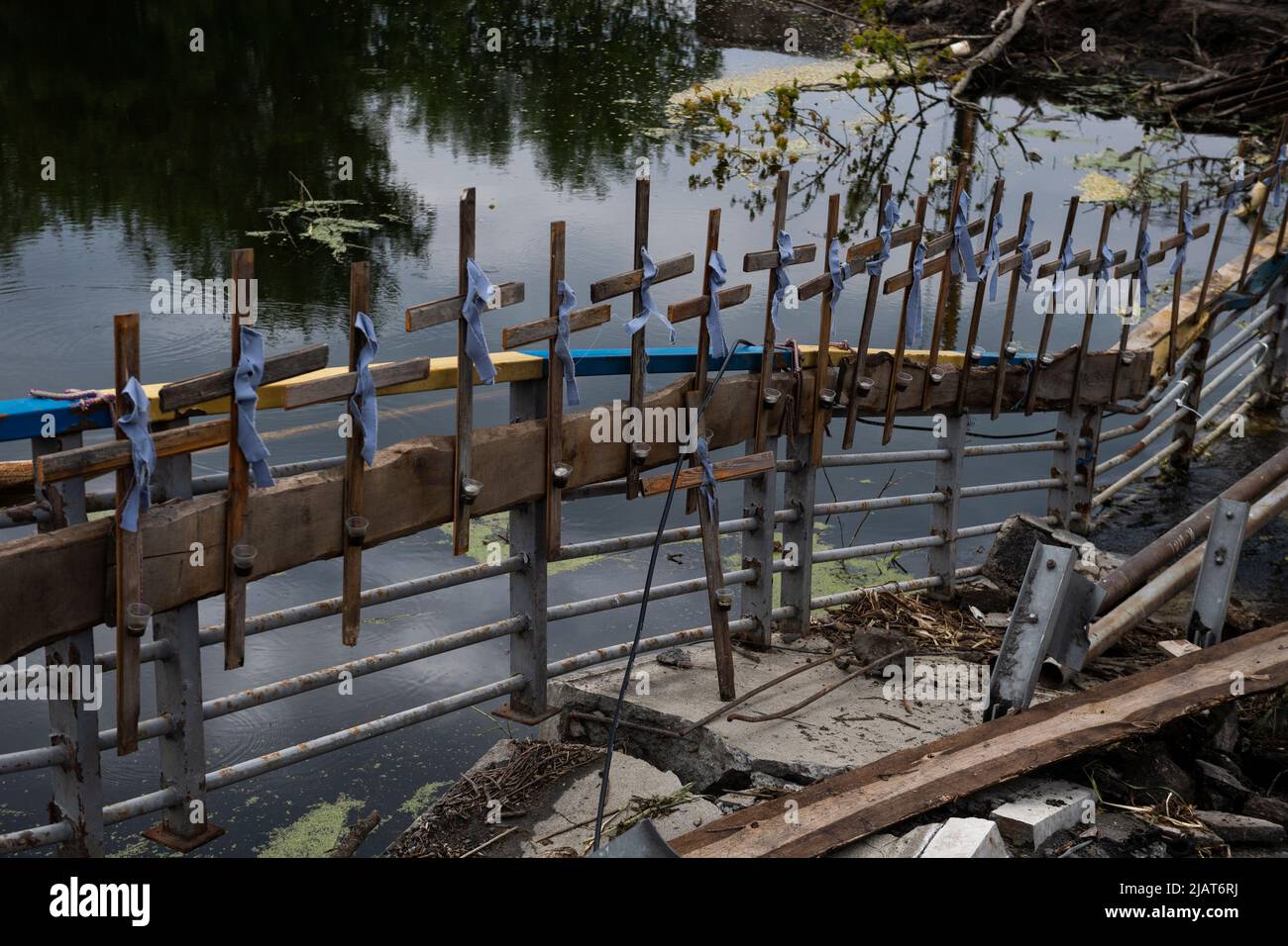 Irpin, Ukraine. 30th May, 2022. Crosses are seen at the destroyed ...