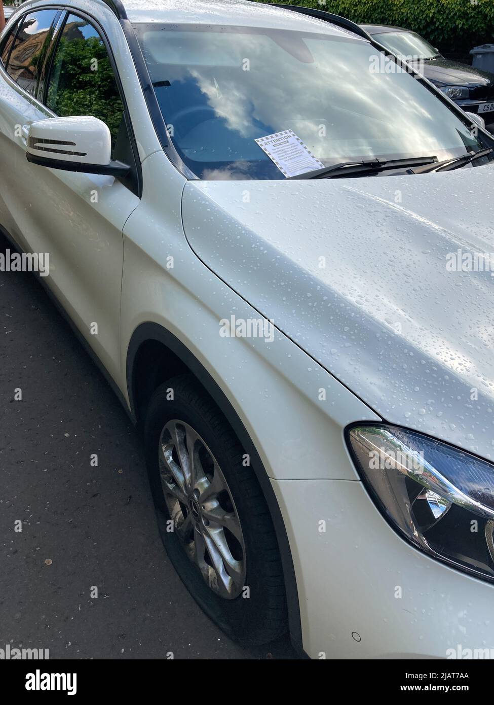Glasgow, Scotland, 1st June 2022. Two SUV cars sits with a tyre cut on ...