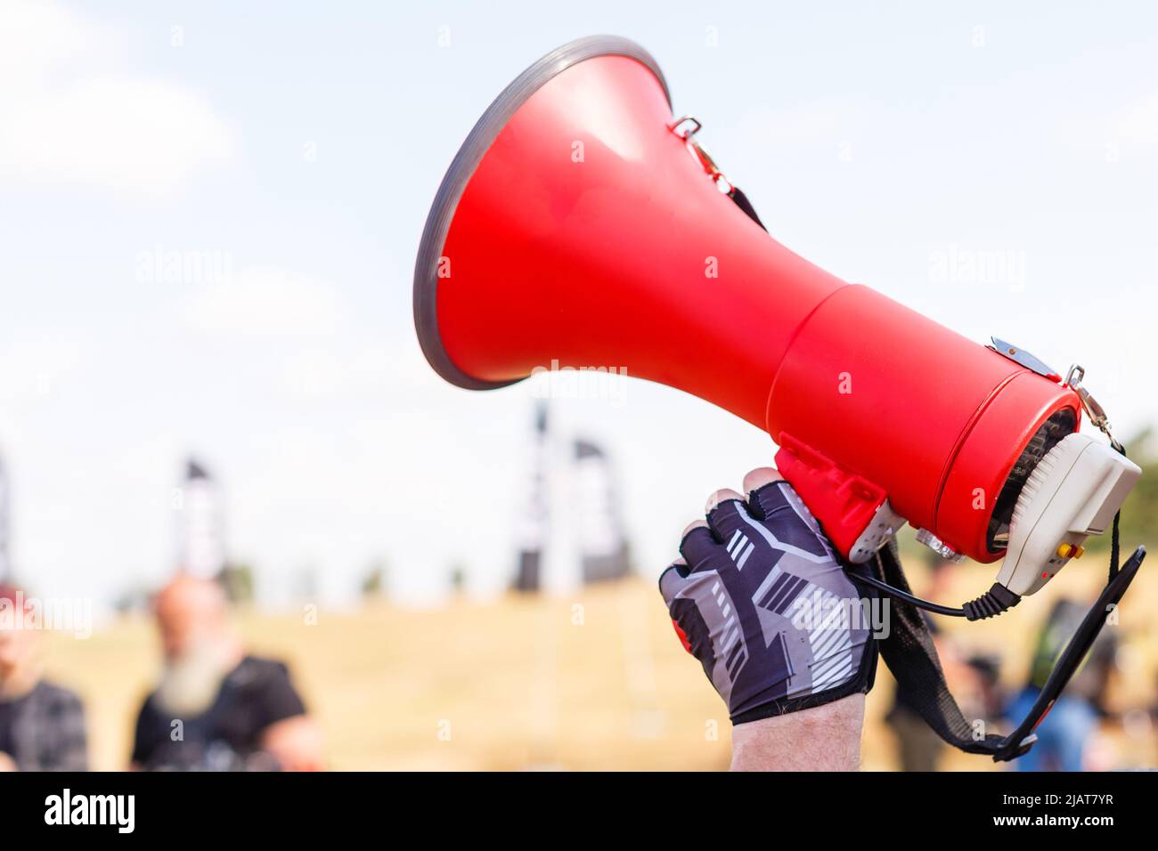 man standing screaming with mouthpiece Stock Photo - Alamy