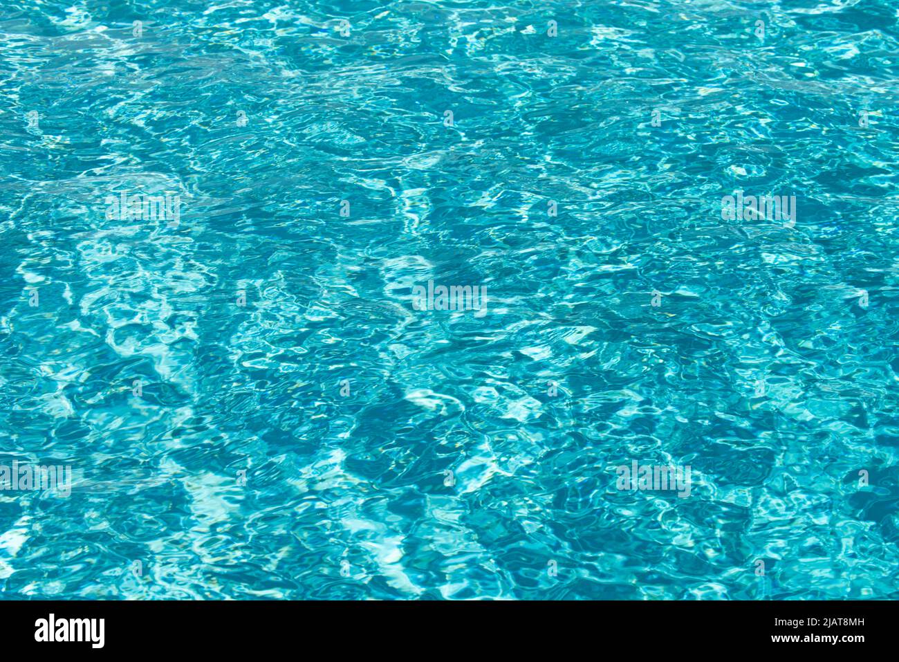 Water in swimming pool, background with high resolution. Wave abstract or rippled water texture ...