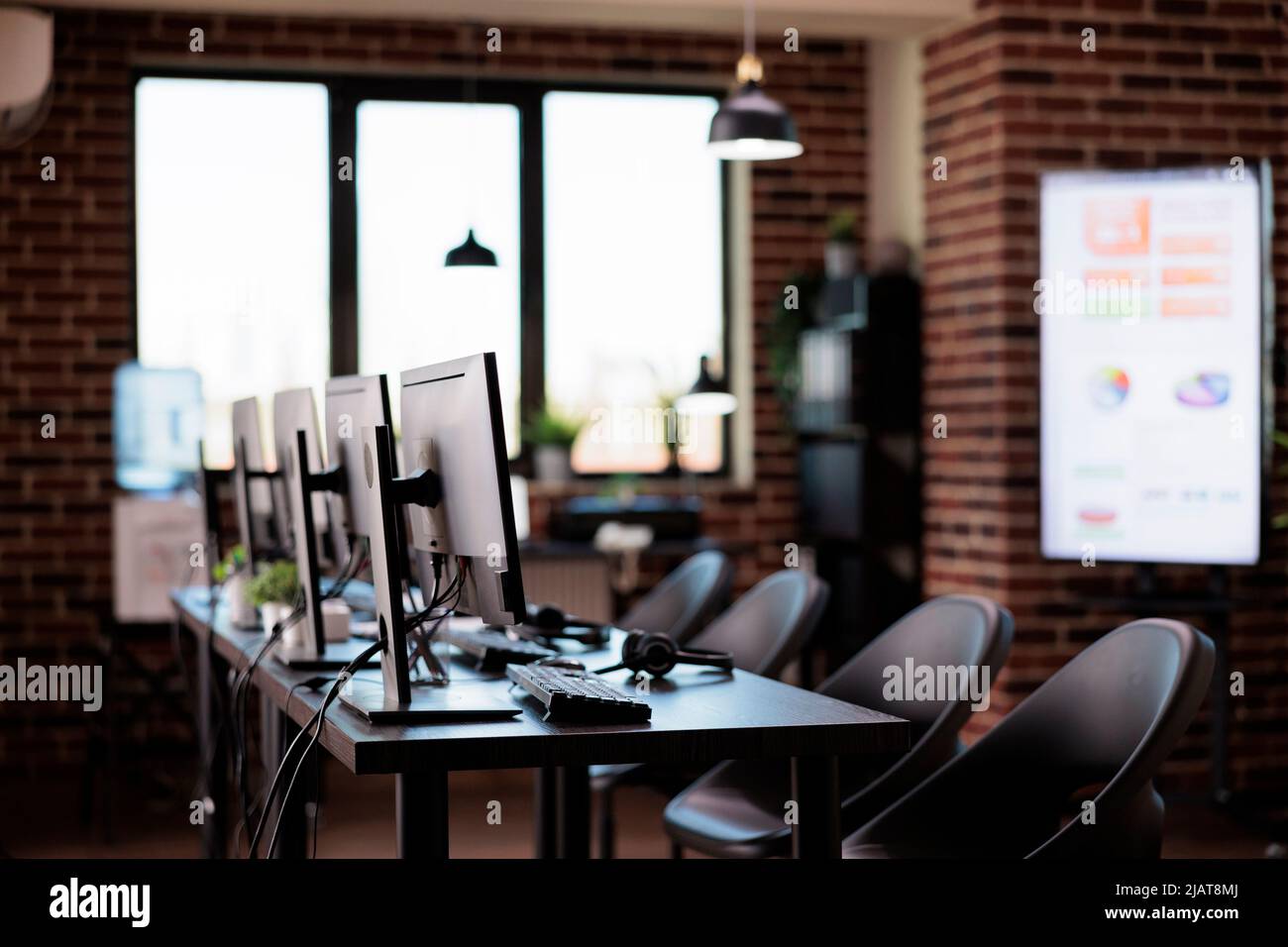 No people in office with multiple computers at customer service desk ...