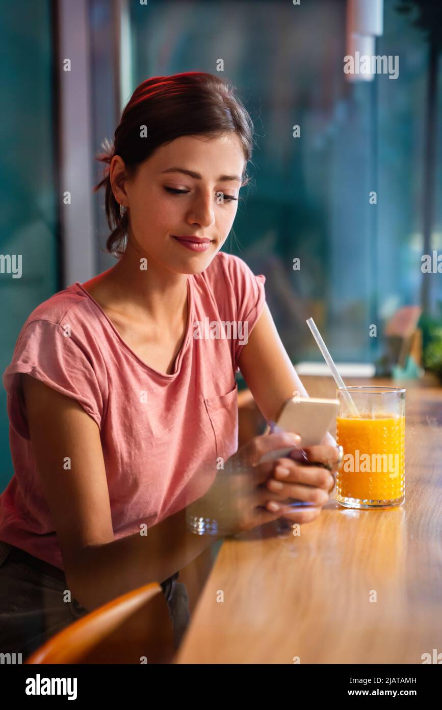 Portrait of happy young woman using smartphone. People mobile phone ...