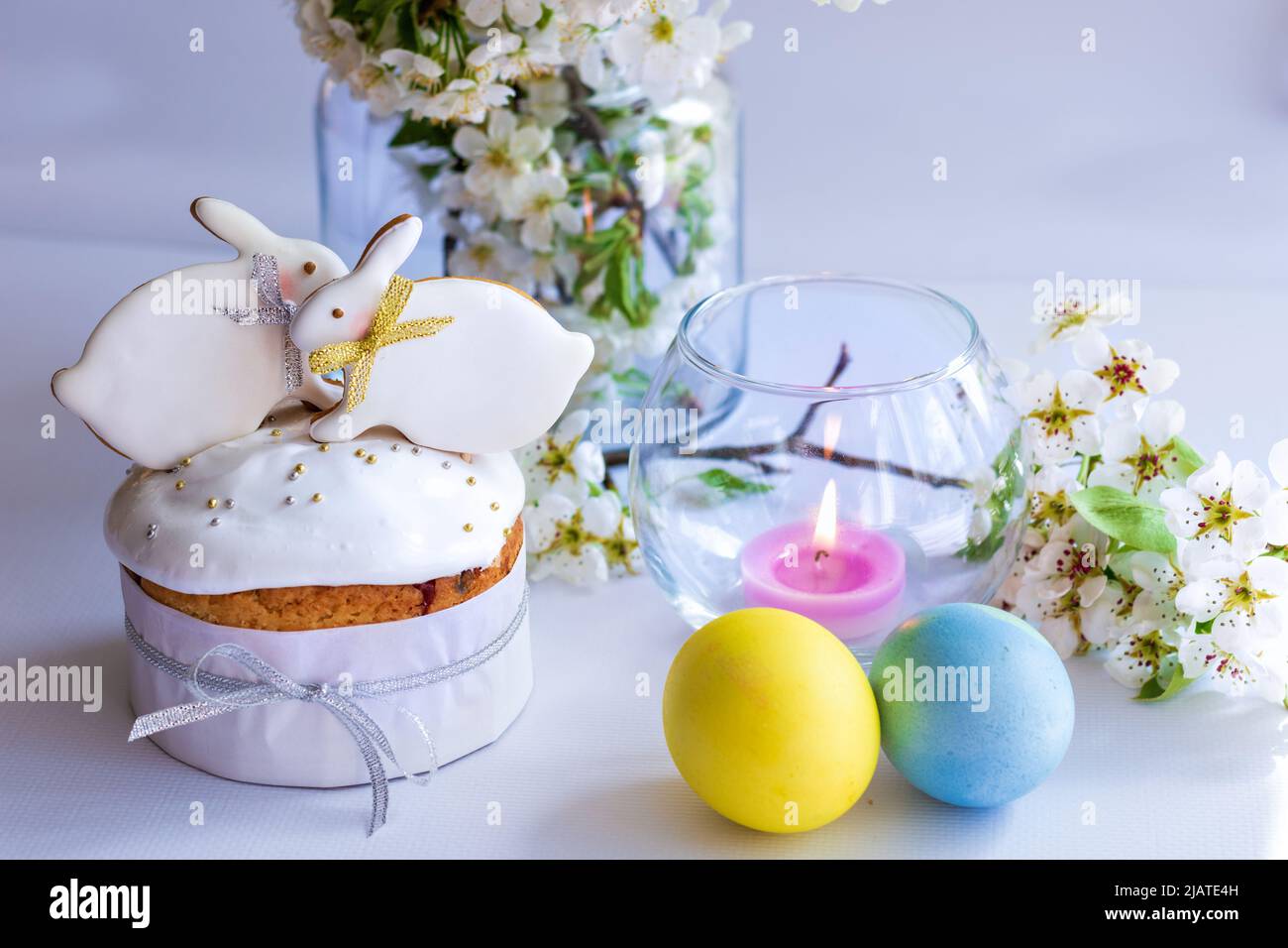 On grey wooden table and Easter Bunny cake, Easter cake in a basket or ...
