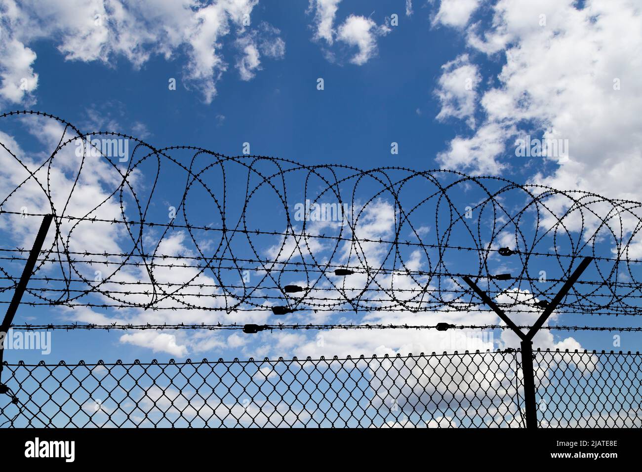 Сontour of barbed wire on background beautiful clouds and sky Stock ...
