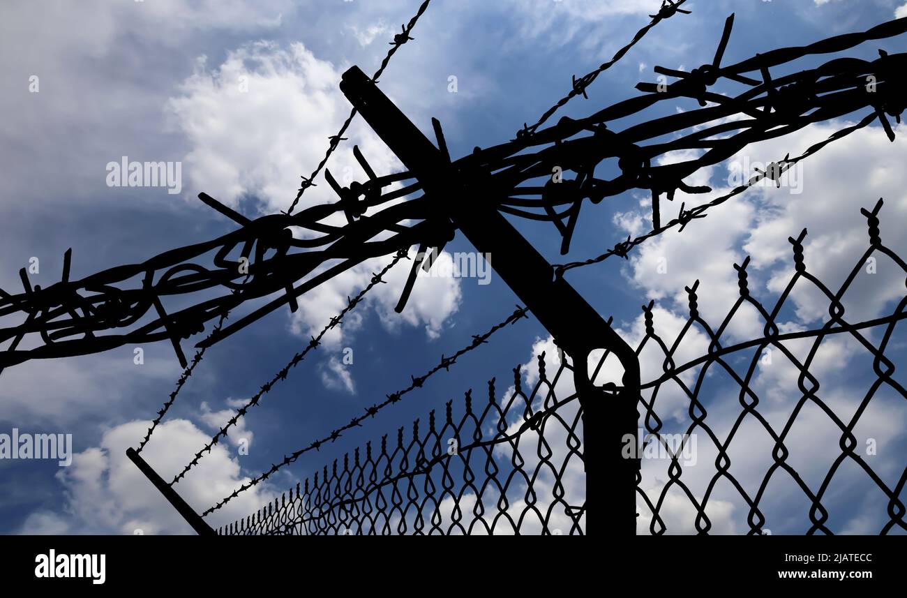 Сontour of barbed wire on background beautiful clouds and sky Stock ...