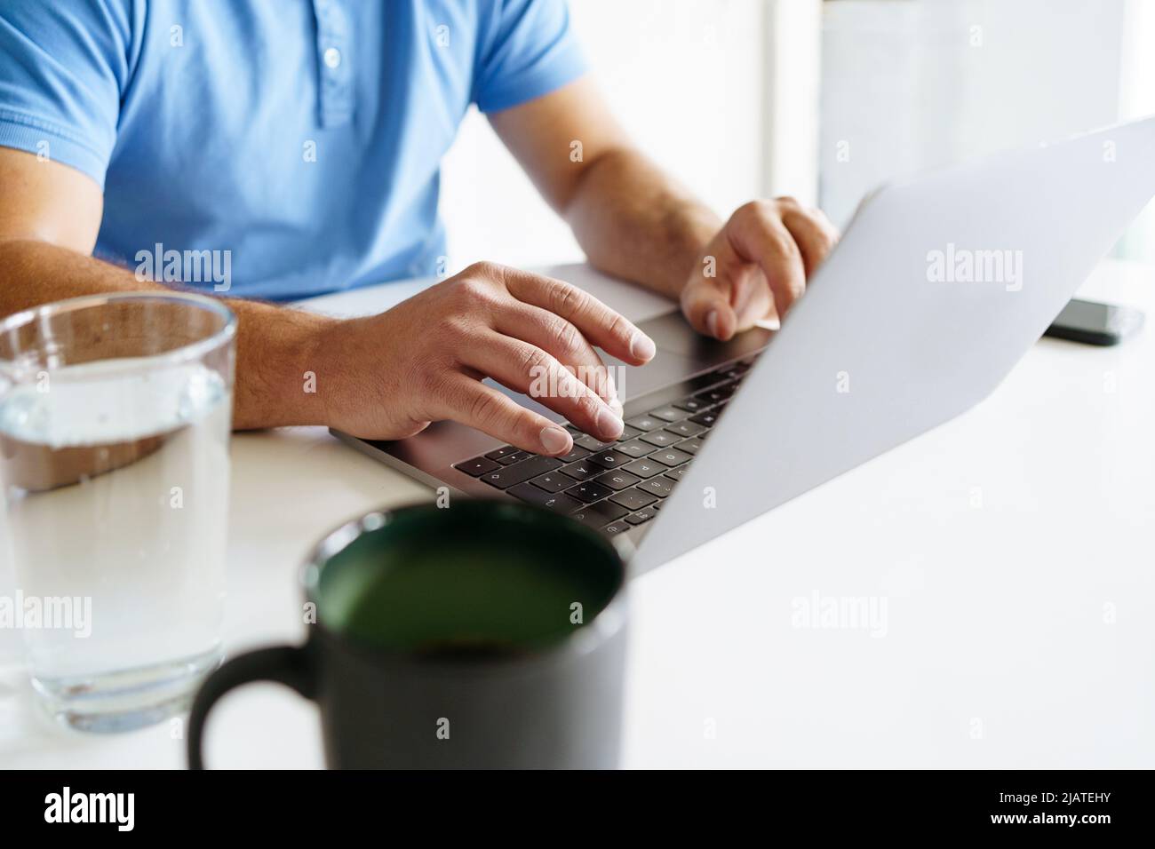 Businessman drinking water at office desk hi-res stock photography and ...
