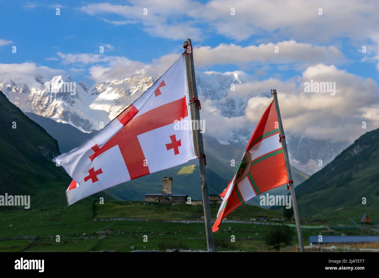 Georgian nationl flag with an amazing view on the Lamaria church in the ...