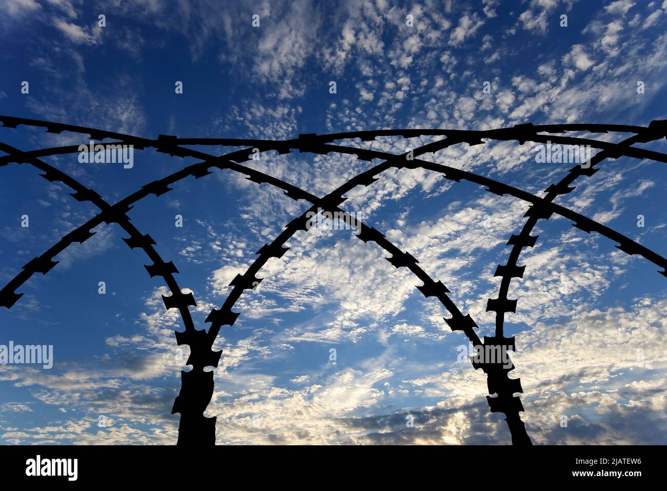 Сontour of barbed wire on background beautiful clouds and sky Stock ...