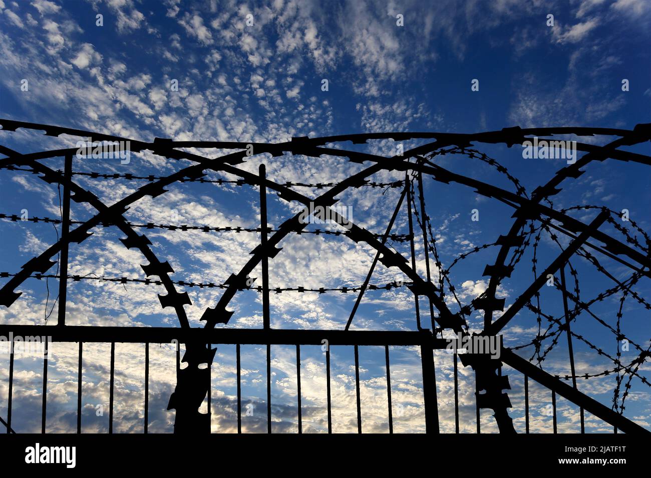 Сontour of barbed wire on background beautiful clouds and sky Stock ...