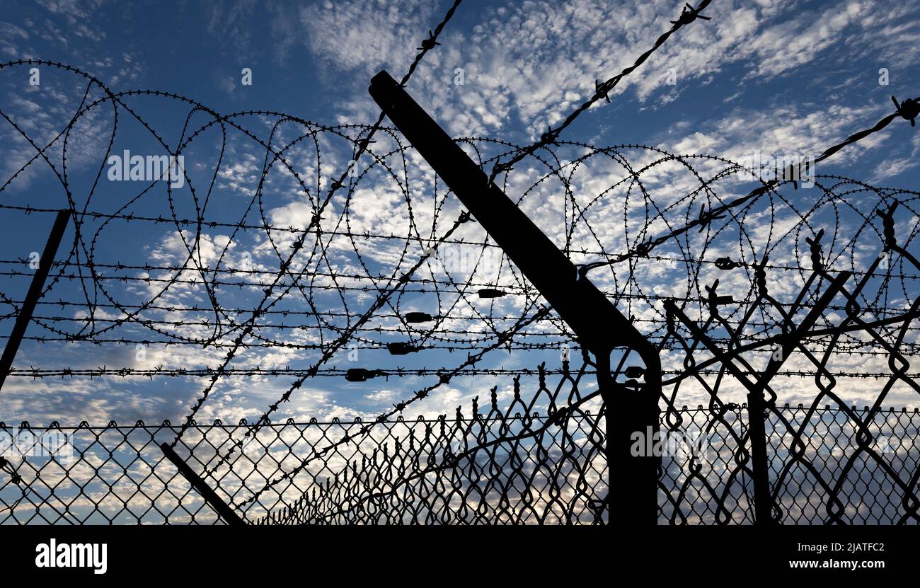 Сontour of barbed wire on background beautiful clouds and sky Stock ...