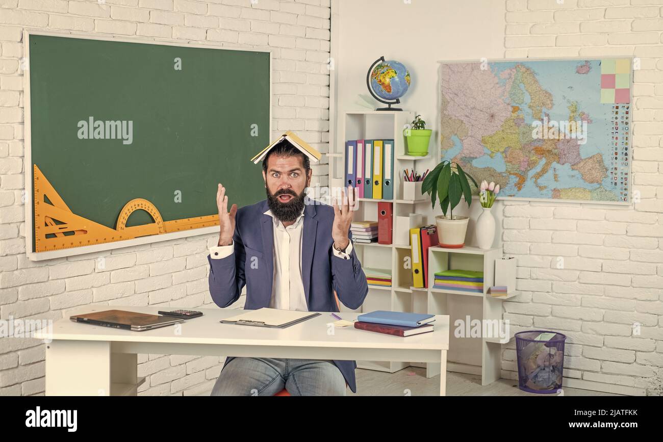 shocked bearded man overworked in school while studying, education ...