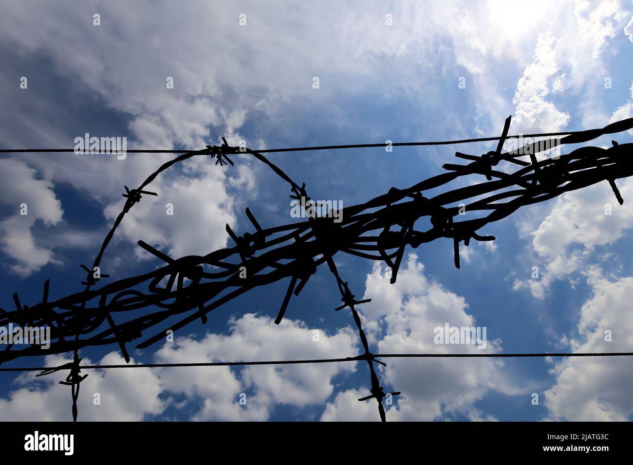 Сontour of barbed wire on background beautiful clouds and sky Stock ...