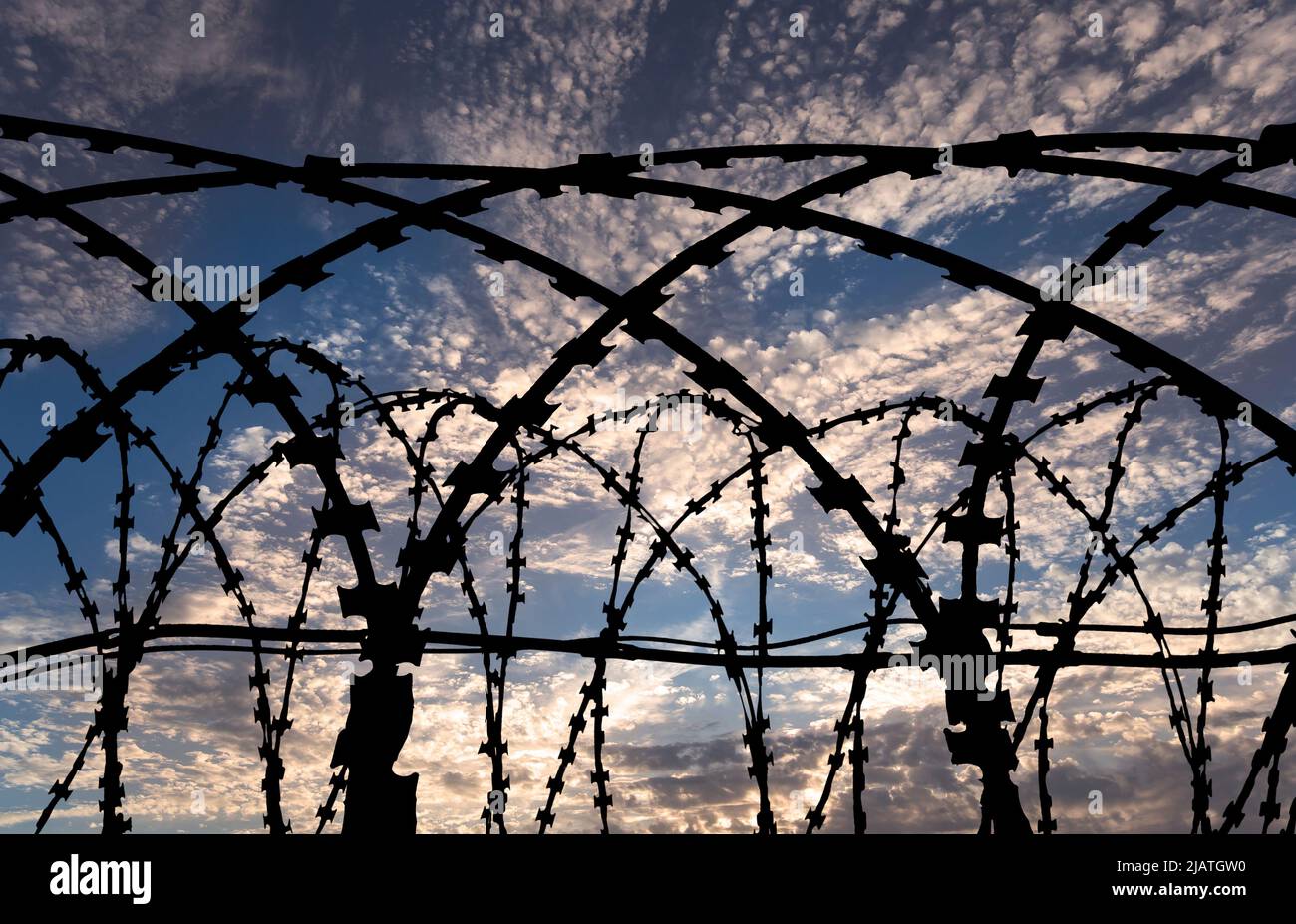 Сontour of barbed wire on background beautiful clouds and sky Stock ...