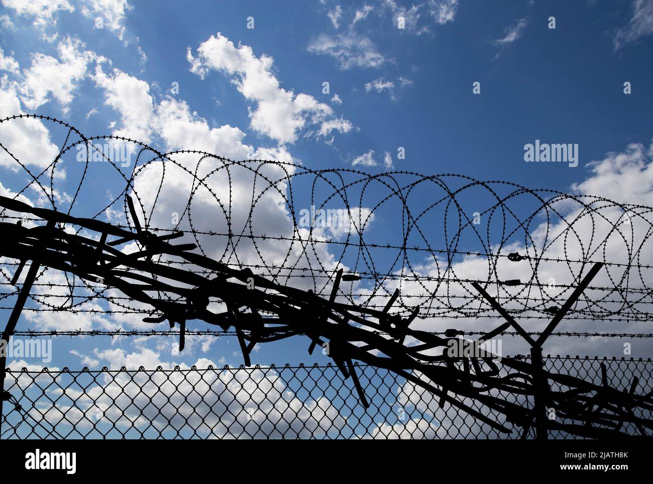 Сontour of barbed wire on background beautiful clouds and sky Stock ...