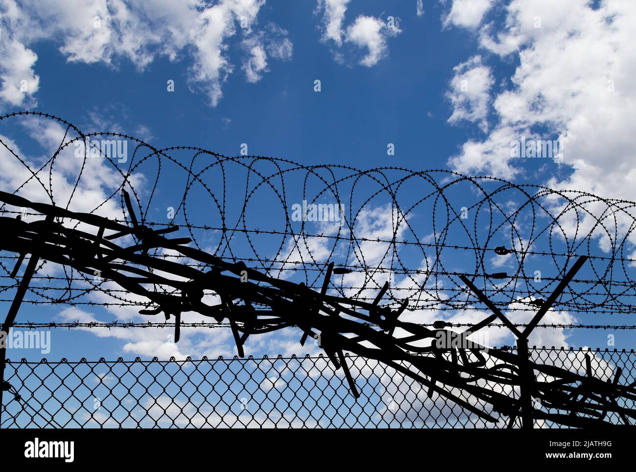 Сontour of barbed wire on background beautiful clouds and sky Stock ...