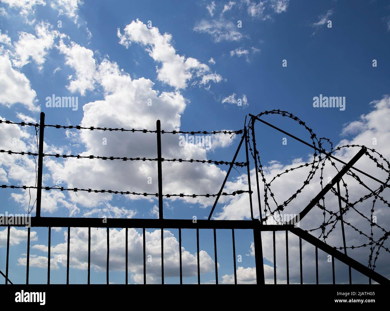 Сontour of barbed wire on background beautiful clouds and sky Stock ...