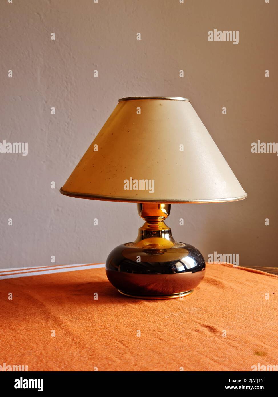 Old lamp on a table Stock Photo - Alamy