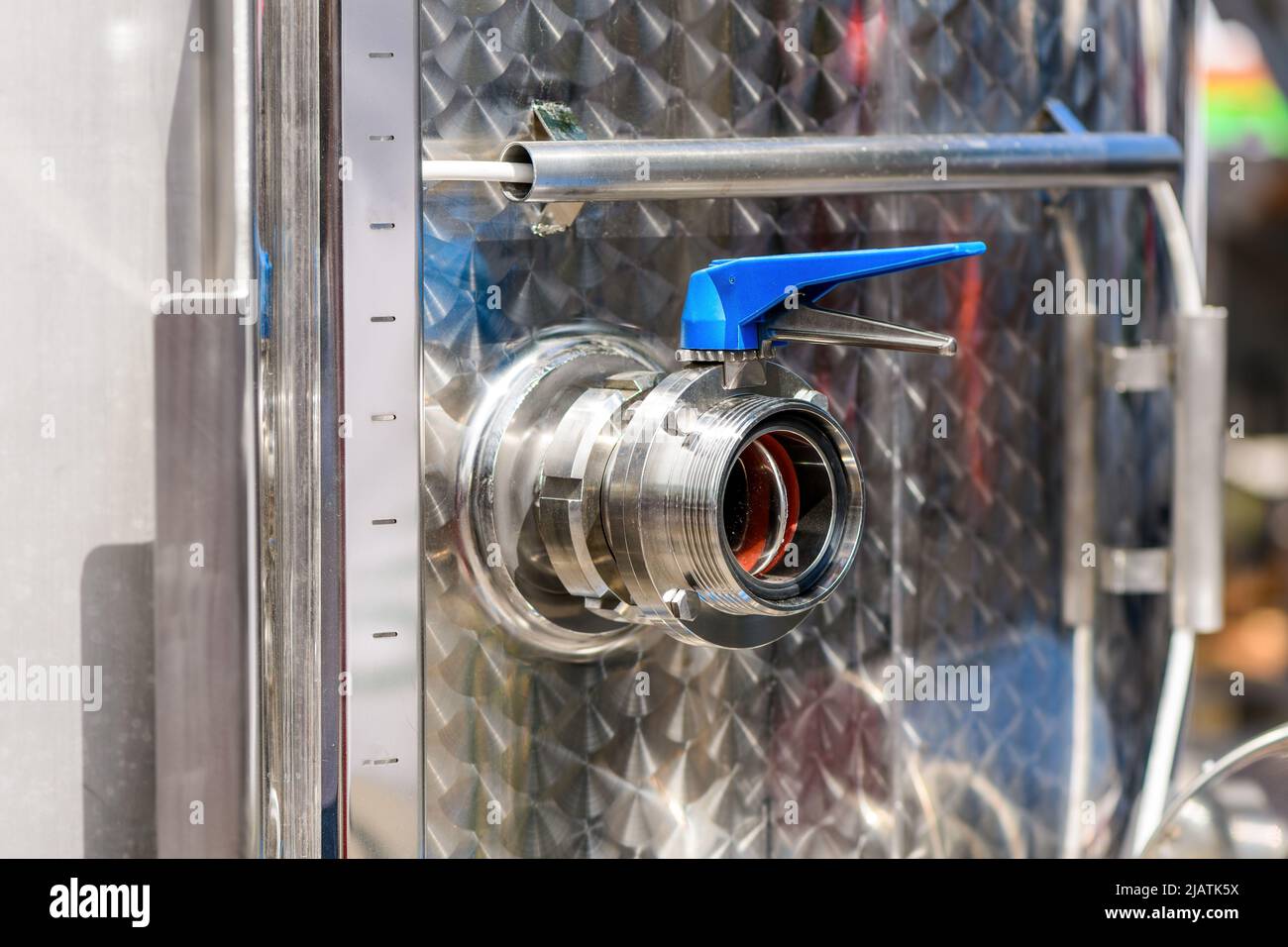 Stainless steel industrial wine making tank valve, selective focus ...