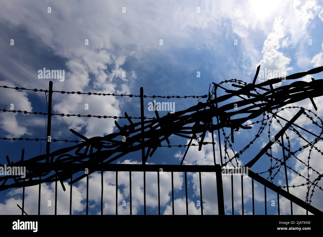 Сontour of barbed wire on background beautiful clouds and sky Stock ...