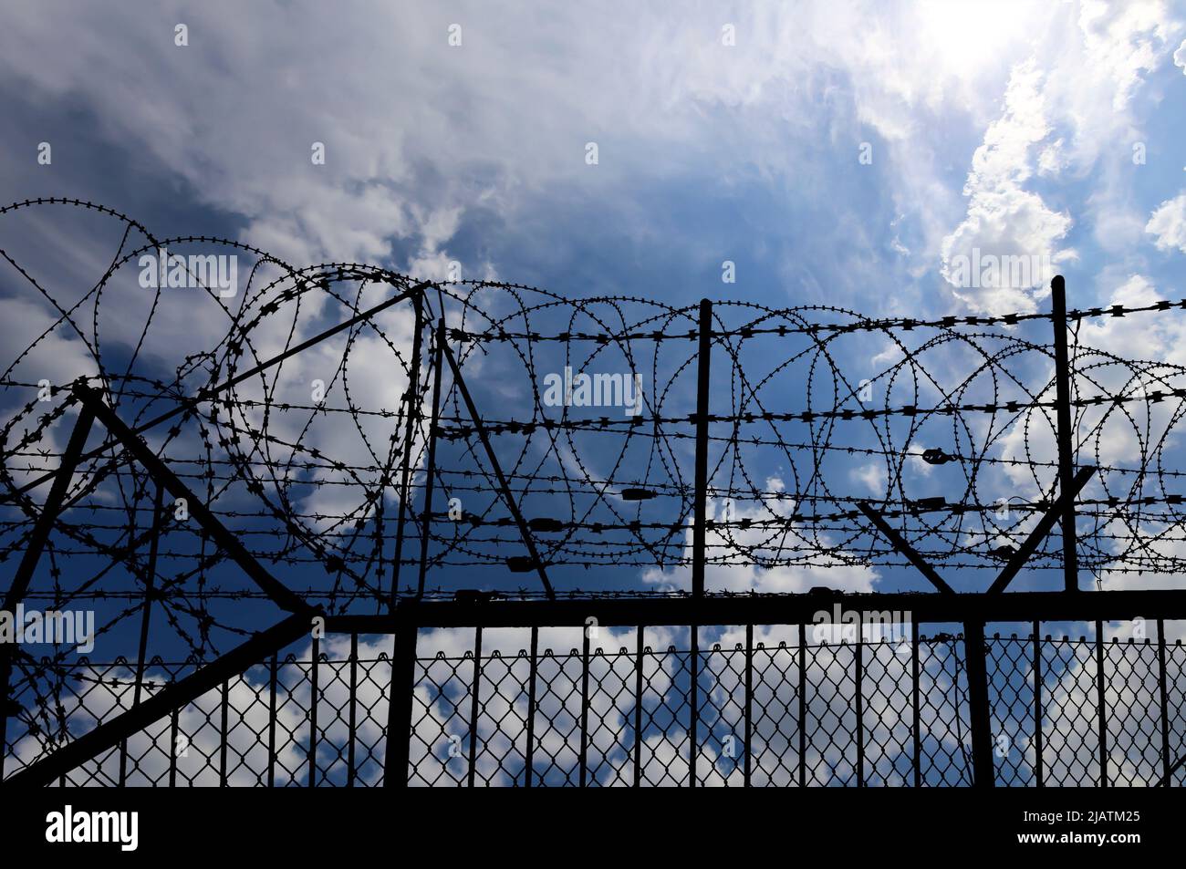 Сontour of barbed wire on background beautiful clouds and sky Stock ...