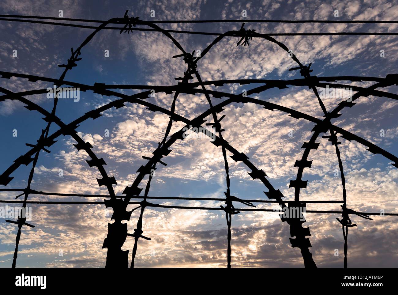 Сontour of barbed wire on background beautiful clouds and sky Stock ...