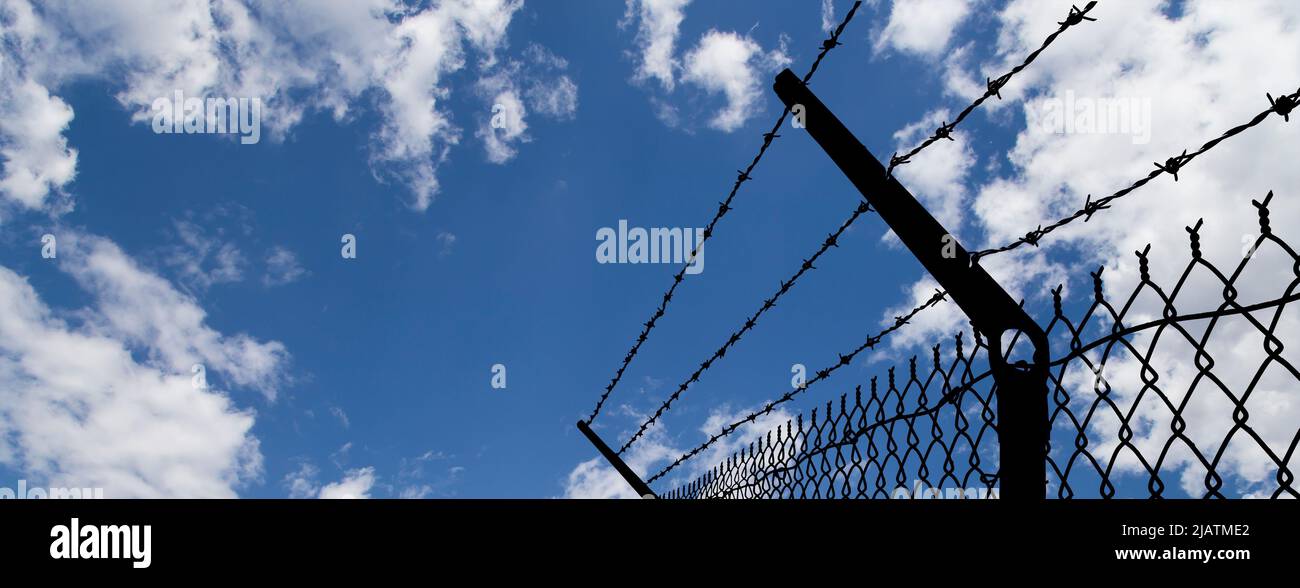 Сontour of barbed wire on background beautiful clouds and sky Stock ...