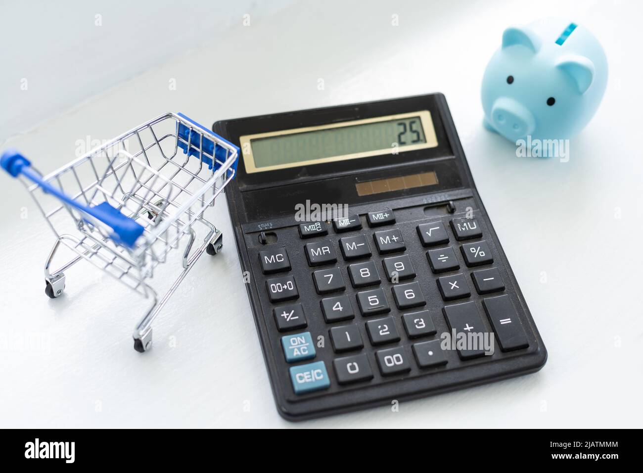 Piggy bank with shopping cart .concept of saving money Stock Photo - Alamy