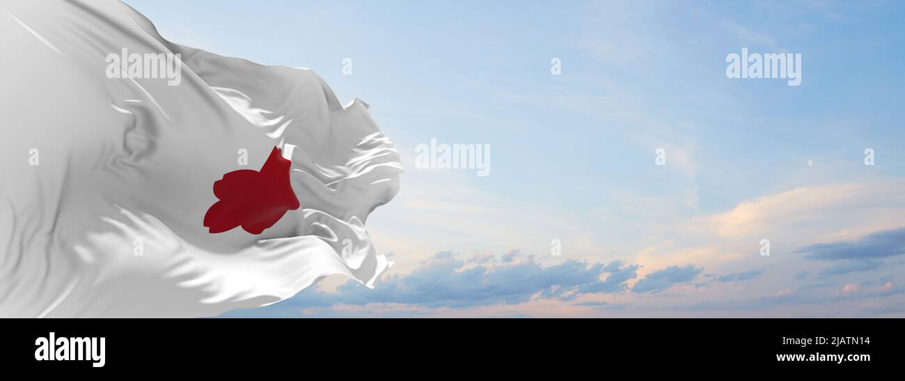 official flag of Standard of Commodore , Japan at cloudy sky background ...
