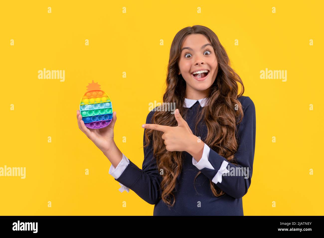 surprised kid pointing finger on pop it silicone sensory fidget game ...