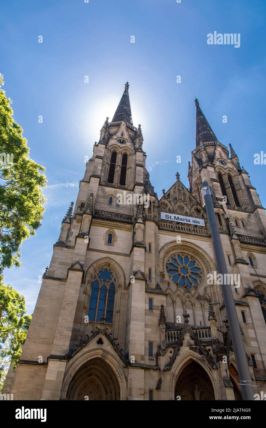 St. Maria Church in Stuttgart with sun illuminated behind the tower ...