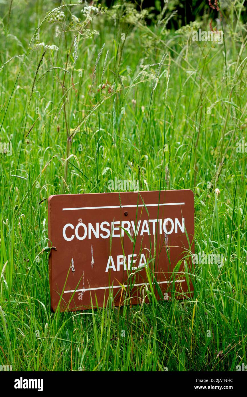 Conservation area sign in St. Leonard`s churchyard, Charlecote ...